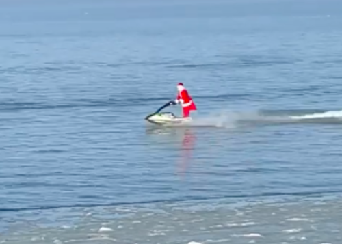 Deadline Detroit | Warm Christmas: Jet Skiing Santa takes Lake St. Clair